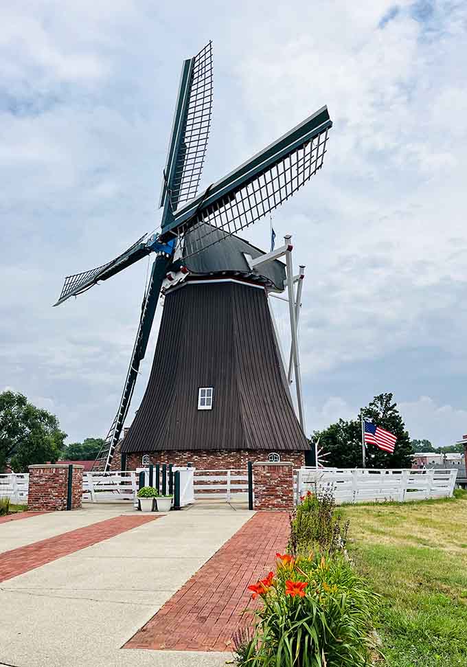 De Immigrant Windmill towers over everything, a delightfully unexpected Dutch giant on the Mississippi River's banks.