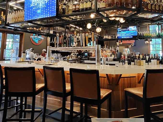 The impressive bar showcases an extensive selection of craft beers and spirits for those who appreciate a well-made cocktail.