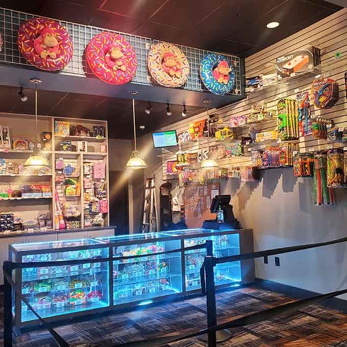 The prize counter gleams with treasures that'll break within hours but create memories lasting years somehow.