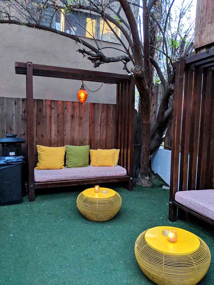 Yellow cushions and astroturf define the outdoor lounge, where California evenings feel even more magical than usual.