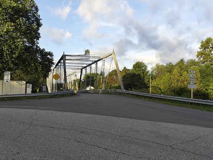 The old truss bridge spans the river like a piece of functional art, connecting both sides of town.