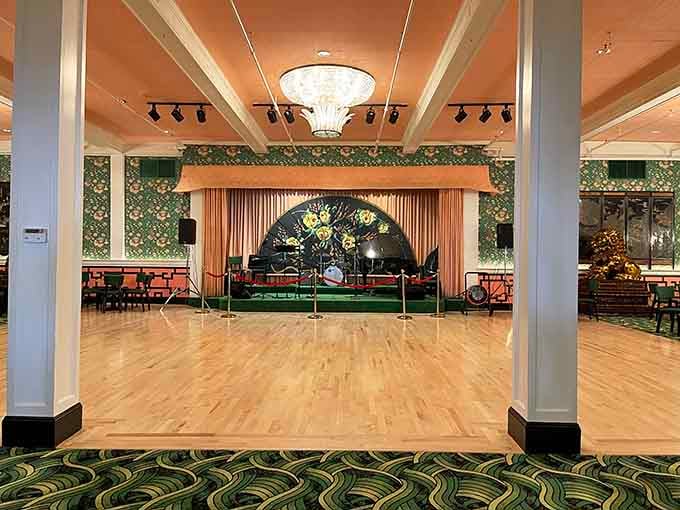 That gleaming dance floor awaits your best moves, chandelier sparkling overhead like something from a Fred Astaire film.