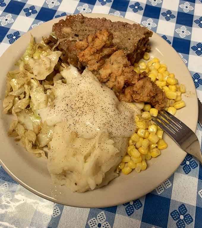 Meatloaf, mashed potatoes, cabbage, and corn deliver the kind of home cooking that fixes whatever's bothering you today.