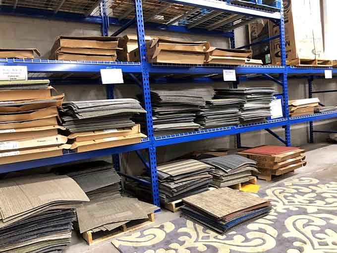 Carpet tiles organized with more precision than most people's sock drawers, ready for your next project.