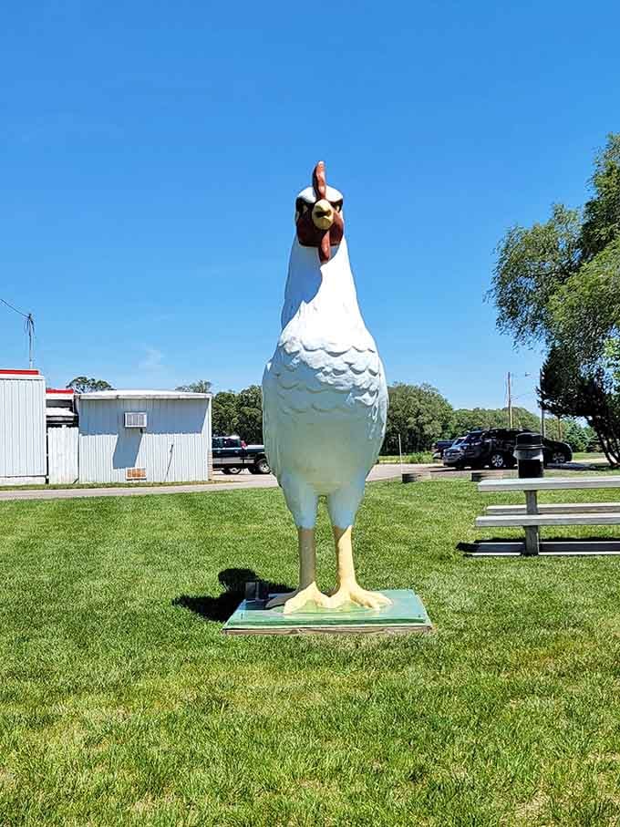 That giant chicken statue standing guard tells you everything you need to know about this place's priorities and pride.