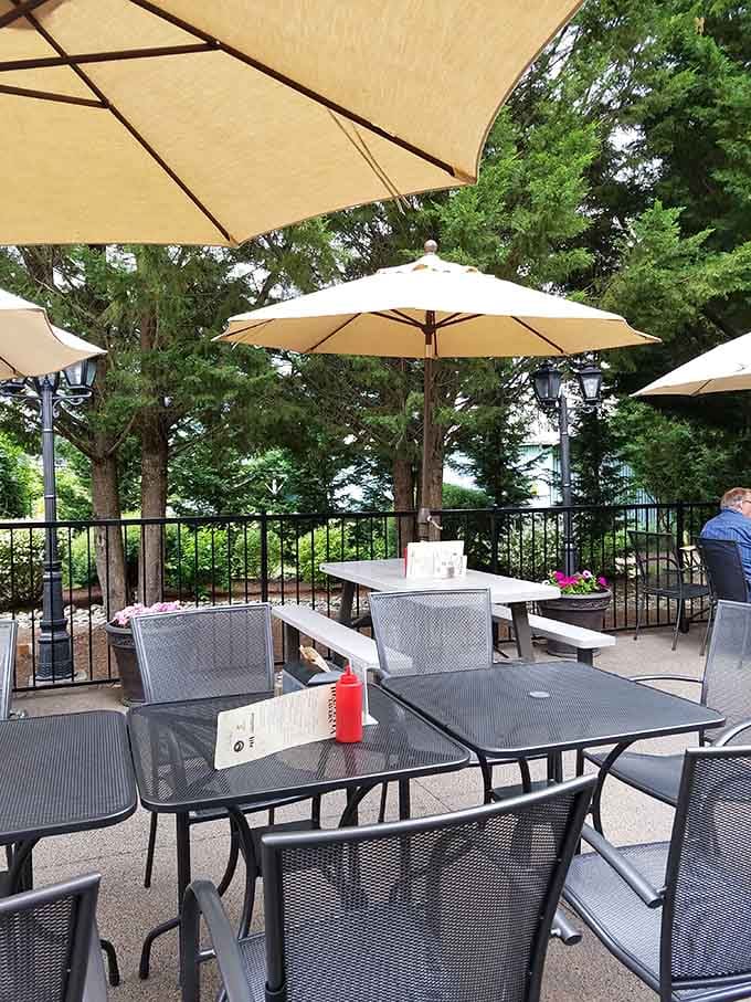 Outdoor seating under umbrellas where you can enjoy your burger with a side of fresh air.