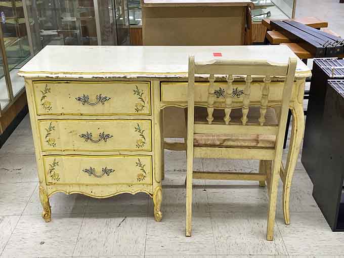A charming vintage desk and chair set with hand-painted details that add character to any home office.