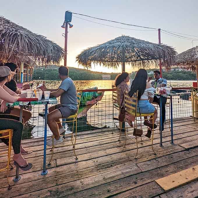 Sunset dining under thatched umbrellas on the lake makes you forget you're still in the same state.