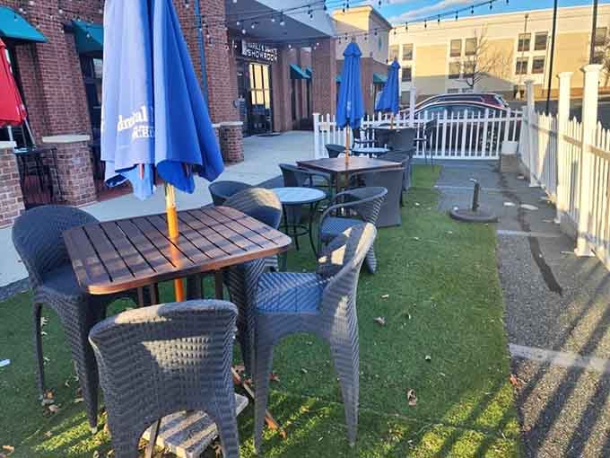 Patio seating with blue umbrellas for when Maryland weather cooperates with your vacation fantasy.