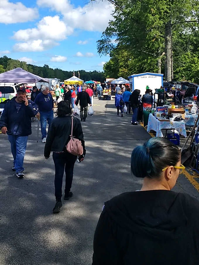 Weekend shoppers navigate the outdoor aisles under blue skies, proving that the best mall has no roof at all.