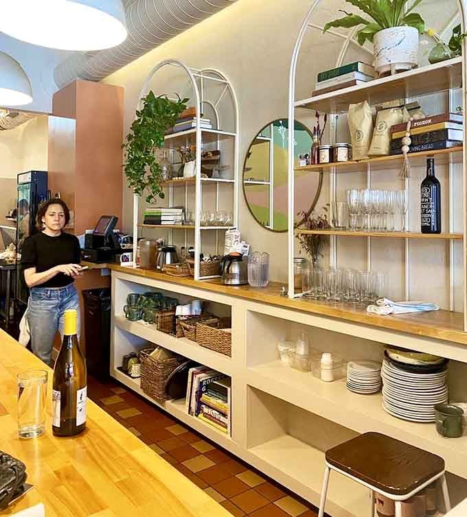 Open shelving displaying dishes and ingredients shows confidence, like they've got nothing to hide and everything to share.