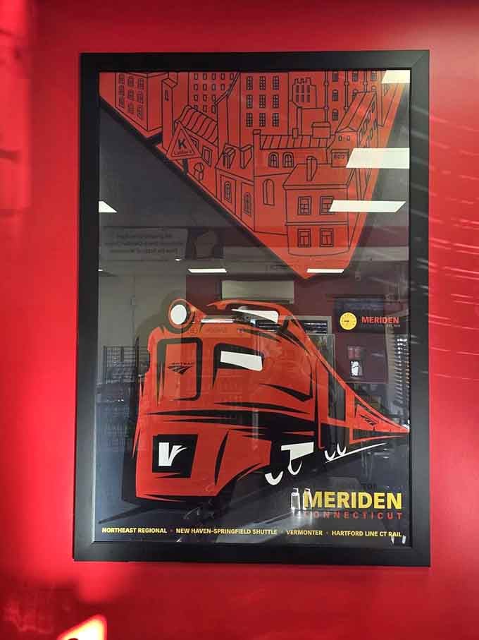 A vintage Meriden train poster celebrates local pride, reminding diners that the best food traditions are often the most regional ones.