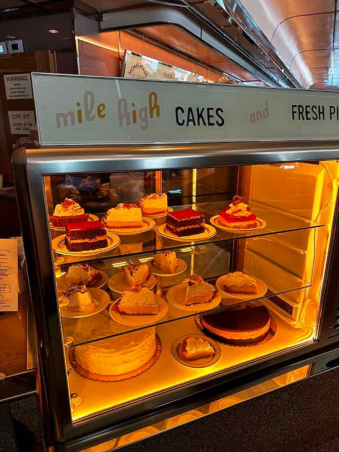 The dessert case beckons like a siren, displaying towering cakes that make willpower seem utterly pointless.