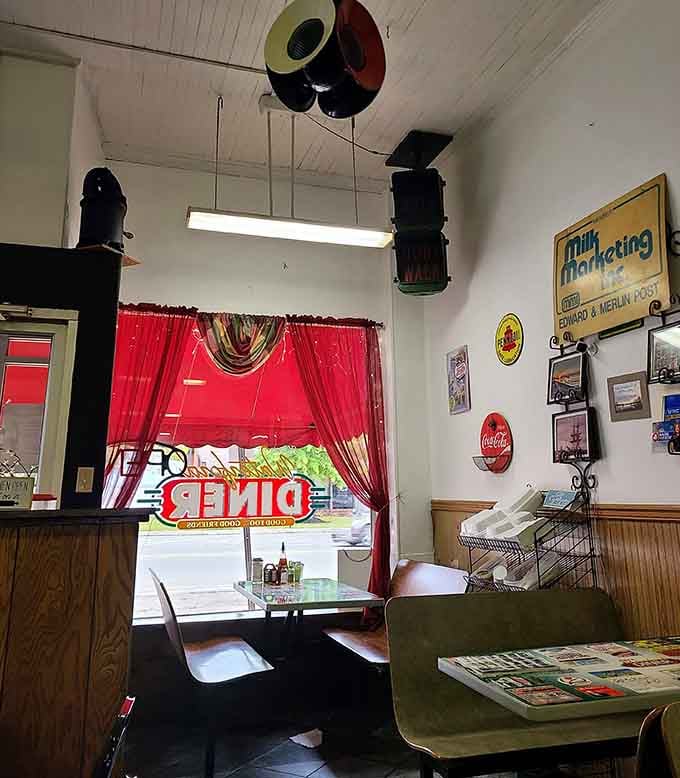 Red curtains and booth seating create cozy corners perfect for lingering over that second cup of coffee.