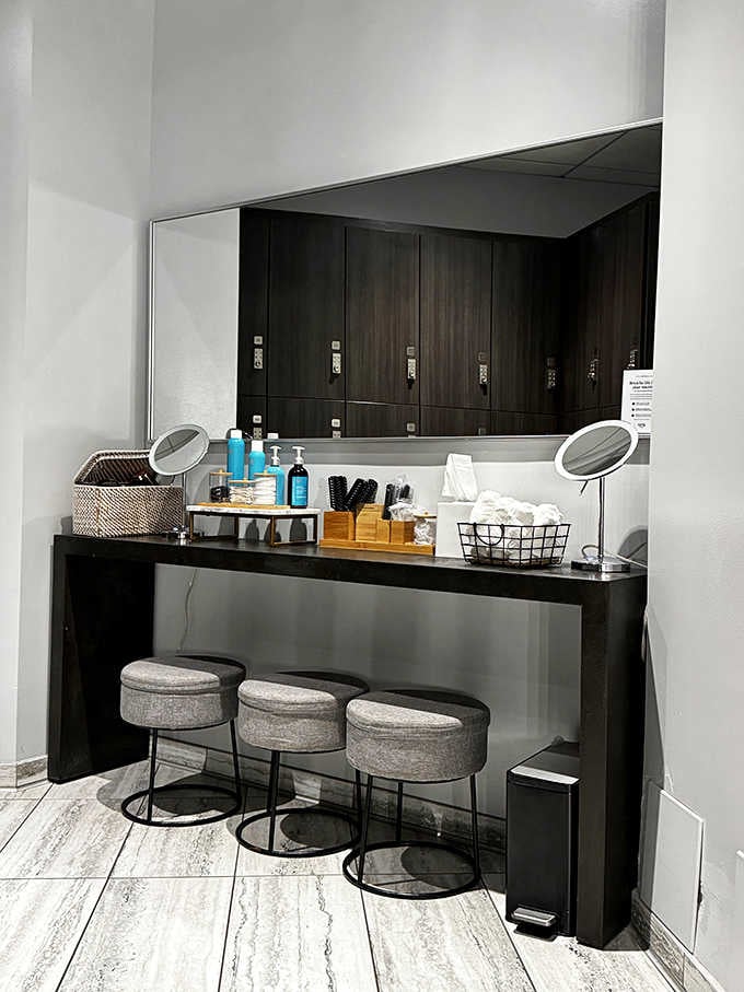 The vanity station with magnifying mirrors and thoughtful seating lets you primp like royalty before heading home.