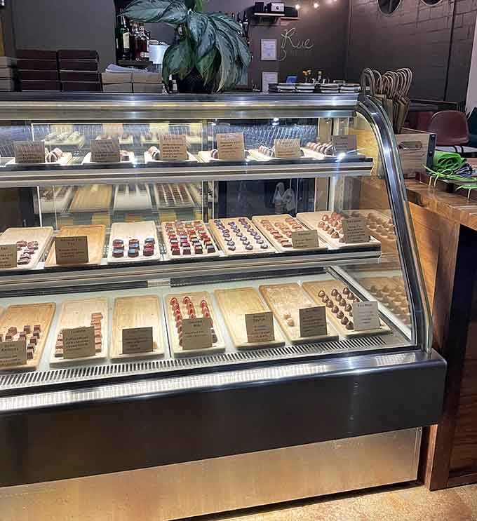 Cozy tables by the window offer the perfect spot to contemplate life's big questions, like which truffle to eat next.