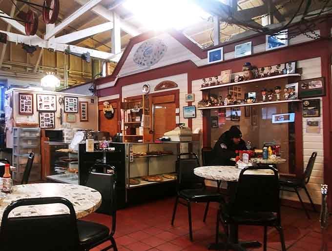 Dining tables surround the train while railroad memorabilia decorates every available wall and surface.