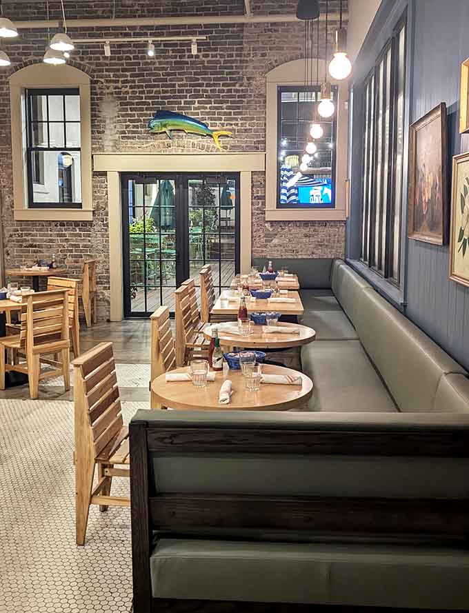 Booth seating meets industrial charm in a space that somehow feels both historic and refreshingly modern at once.