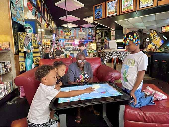 Kids gathered around a digital table game, creating memories that'll outlast any high score they manage to achieve.