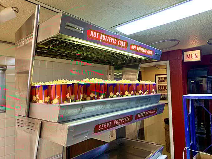 Self-serve popcorn butter stations where portion control goes to die a delicious, buttery death.
