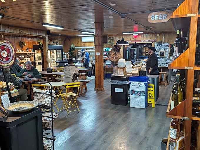 Bistro tables and warm wood everywhere create a space that feels like someone's really cool mountain retreat opened for business.