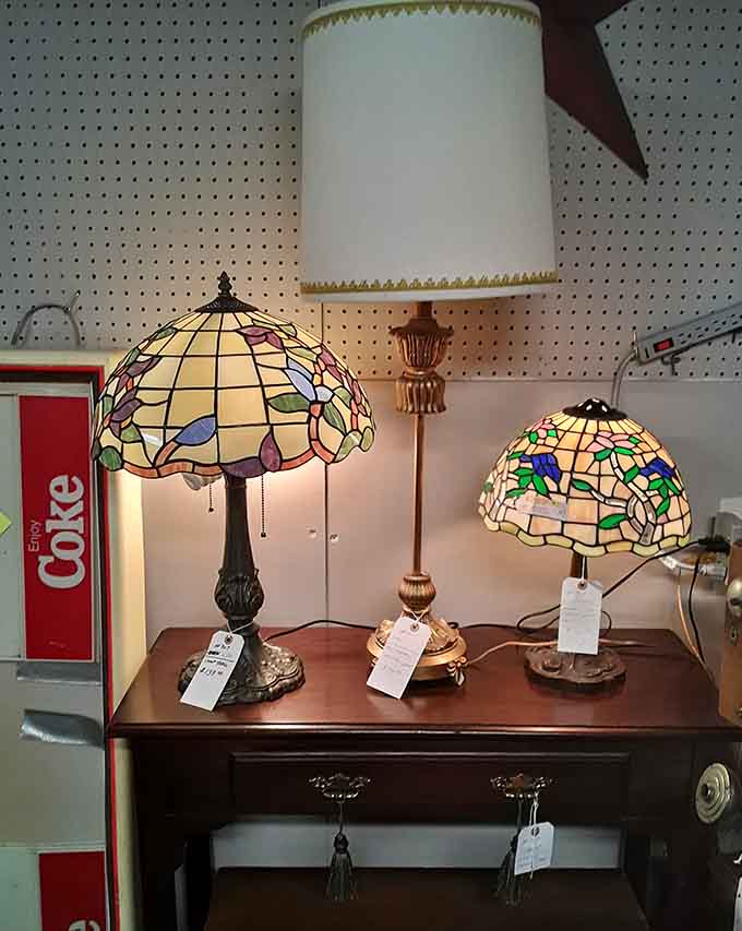 Tiffany-style lamps casting colorful glows, proving that functional lighting can also be absolutely stunning works of art displayed.