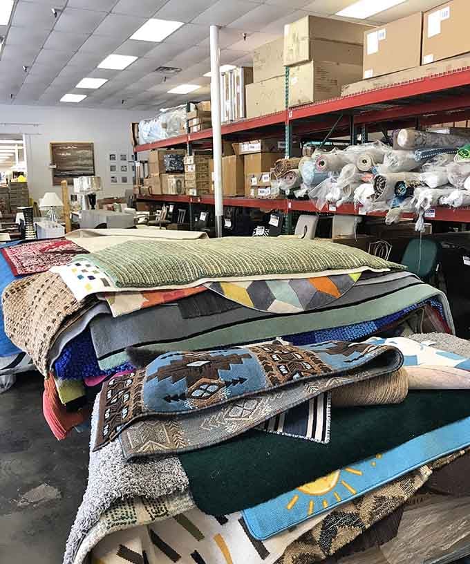 Rugs stacked like a textile tower, offering patterns and colors to transform any room into something magazine-worthy immediately.