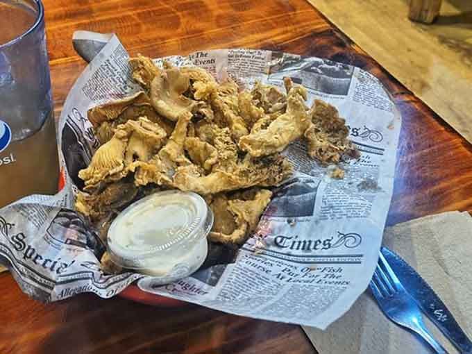 Golden fried mushrooms that prove vegetables can be just as indulgent as everything else on this glorious menu.