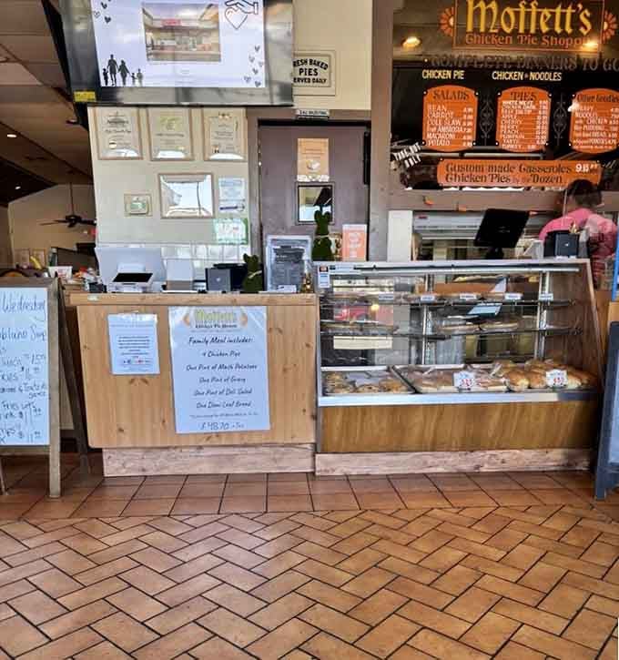 Behind this counter, fresh pies await their moment to make someone's day infinitely better than before.