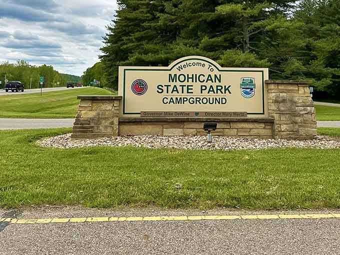 Welcome to Mohican, where the sign promises natural beauty and actually delivers on that promise spectacularly.