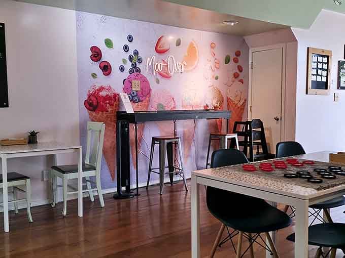 Whimsical wall art featuring floating ice cream cones sets the playful tone for this allergen-free dessert paradise.