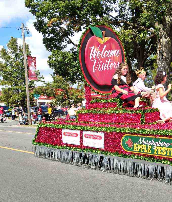 The Welcome Visitors float says it all, covered in enough red tissue paper to wrap every present until Christmas.