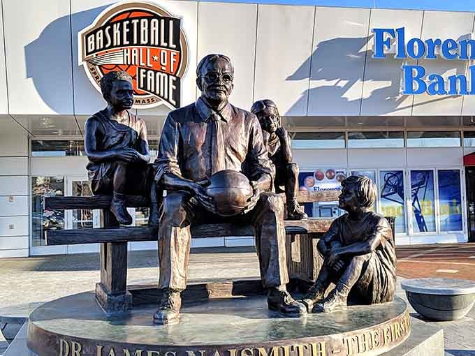 This bronze sculpture honors the game's inventor and the children who first played with peach baskets and dreams.