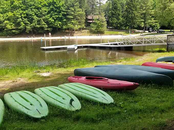 Colorful kayaks lined up like candy, each one promising a different adventure across water that's calling your name.