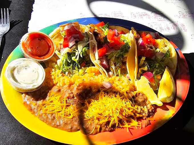 Tacos, rice, beans, and enough melted cheese to suggest someone in the kitchen really understands what people want.