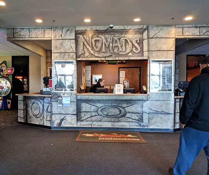 The admission desk welcomes families into organized chaos, where fun is the only currency that matters.