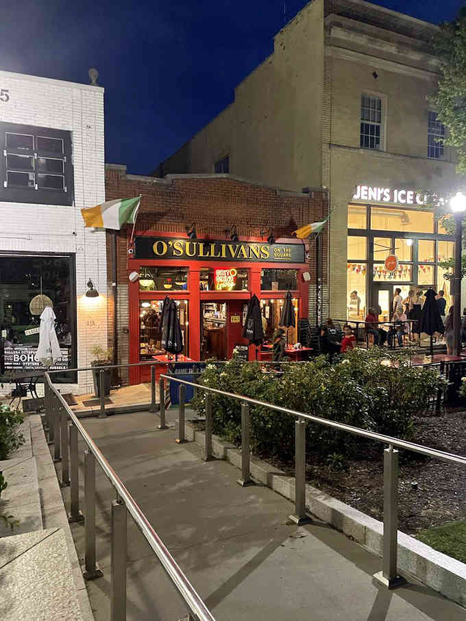 Evening lights illuminate the welcoming red facade as Decatur's nightlife comes alive around this beloved gathering spot.