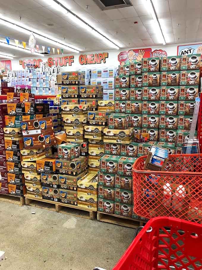 Single-serve coffee pods stacked to the ceiling because your morning caffeine habit deserves affordable fuel for life.
