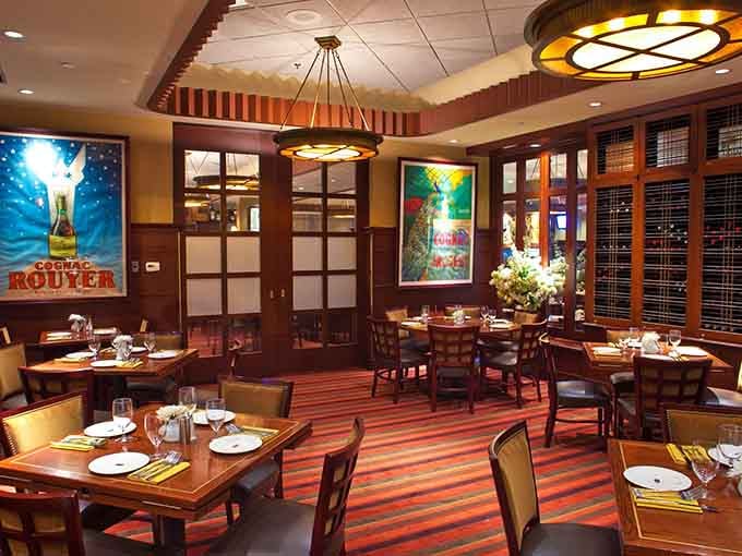 The spacious dining room with colorful artwork creates an upscale yet welcoming vibe for every special occasion.