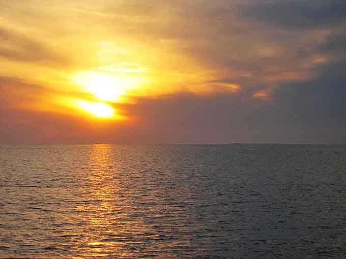 Sunsets over the sound paint the sky in colors that make you forgive every traffic jam back home.