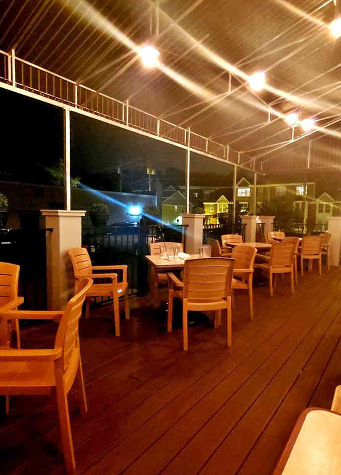 Evening patio dining under twinkling lights, making ordinary weeknights feel like special occasions worth celebrating.