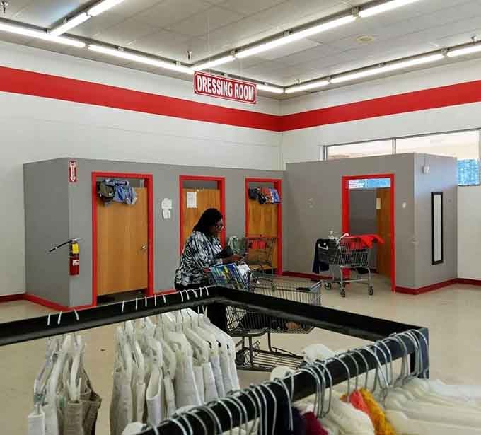 Dressing rooms with bright red trim where you can try on your finds without the judgment of fancy boutique mirrors.
