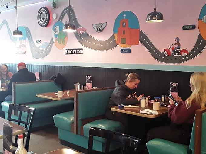 Those turquoise booths have seen countless breakfast conversations, family gatherings, and plates of legendary biscuits and gravy.