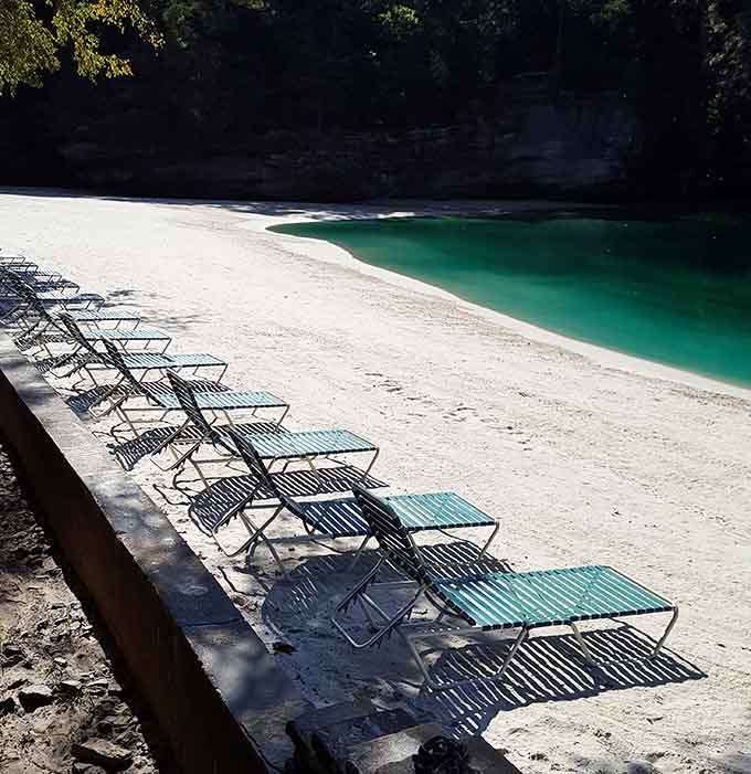A row of lounge chairs facing that pristine beach practically demands you claim one immediately.