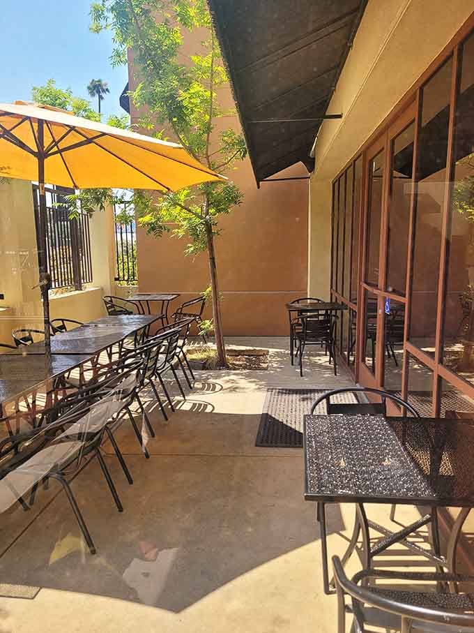 Patio seating under umbrellas offers the perfect California lunch spot with shade and fresh air.