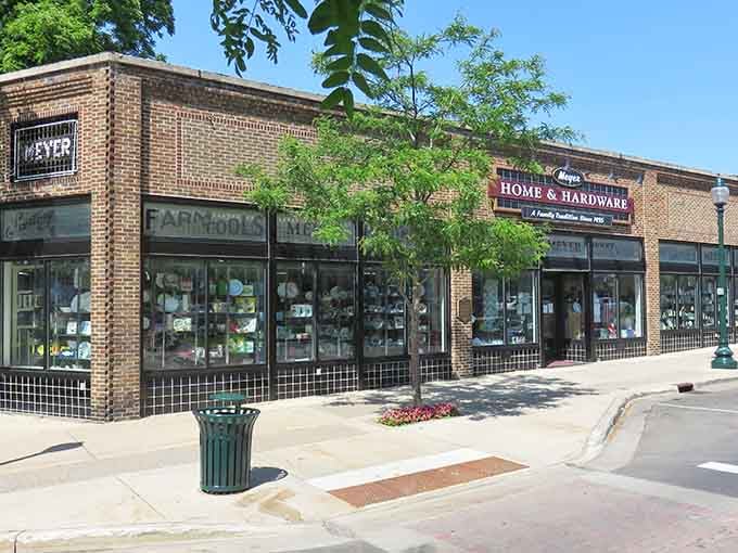 Classic brick storefronts housing local businesses prove that supporting your neighbors never goes out of style, no matter what decade it is.
