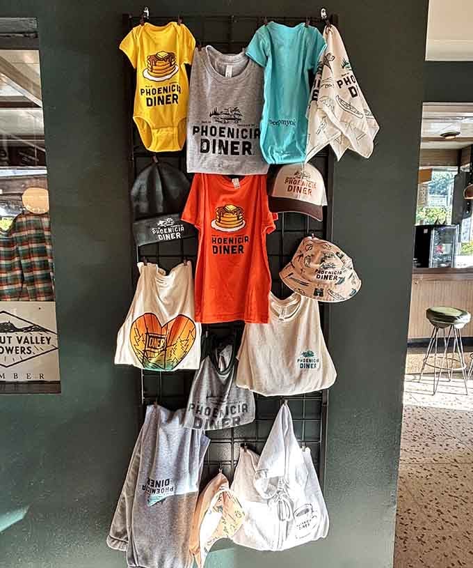Merchandise displays featuring pancake graphics and tote bags let you take home proof that you found breakfast paradise in the mountains.