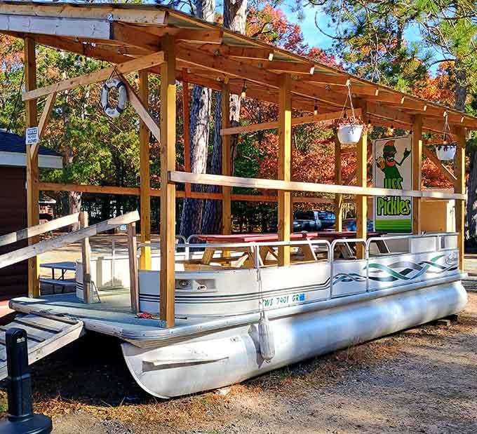 A pontoon boat repurposed as outdoor seating, because why should creativity stop at the menu in the Northwoods?