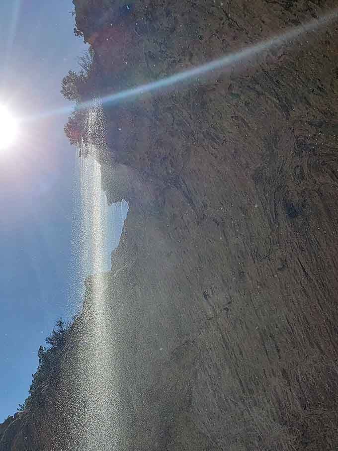 Looking up from below, the waterfall appears framed by rock like a masterpiece hung in nature's own museum.