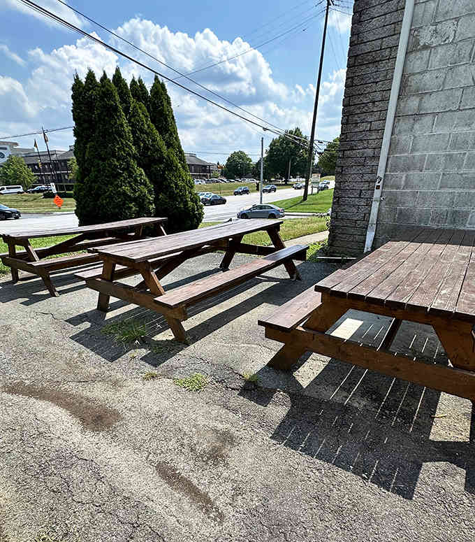 Picnic tables waiting patiently for diners who understand that great food needs no fancy setting.